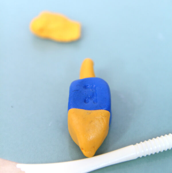 How to Make a Dreidel Out of Clay - Jewish Moms & Crafters